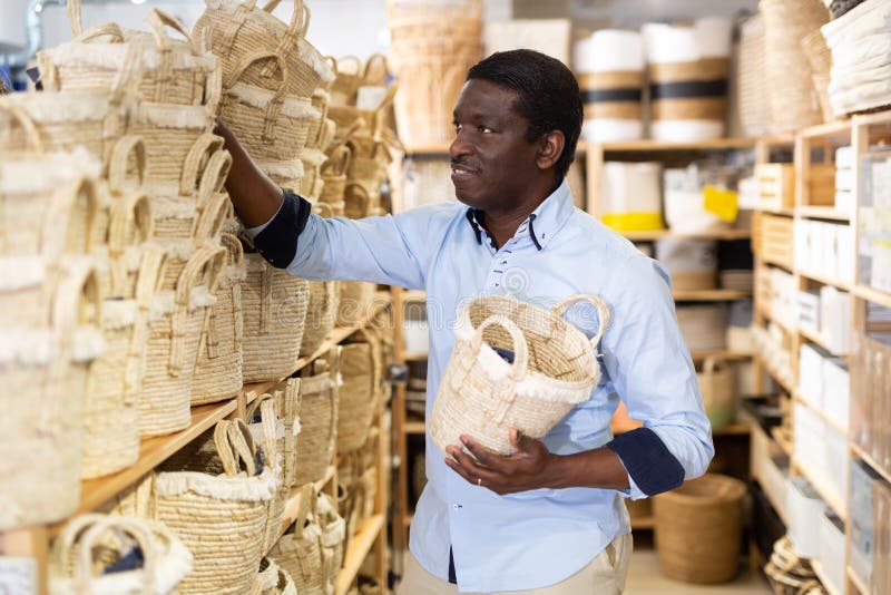 Man Choosing Wicker Basket at Hardware Store Stock Photo - Image of ...