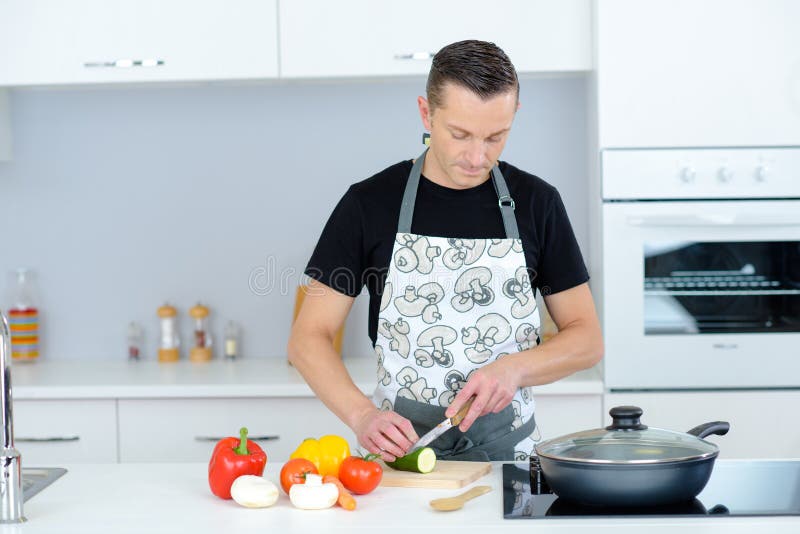 Man Chopping Vegetables in Kitchen Stock Image - Image of male, home ...
