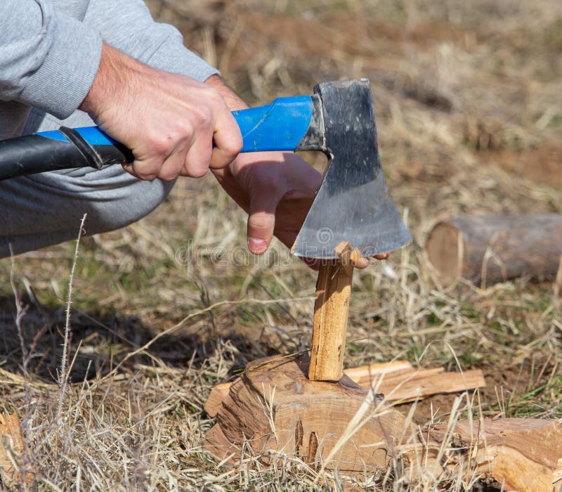 Man Splitting Wood With An Ax Stock Photo - Image of lumber, tool: 31710634