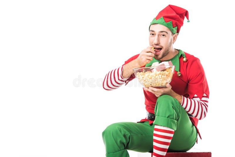 Man in Christmas Elf Costume Eating Popcorn and Looking at Camera ...