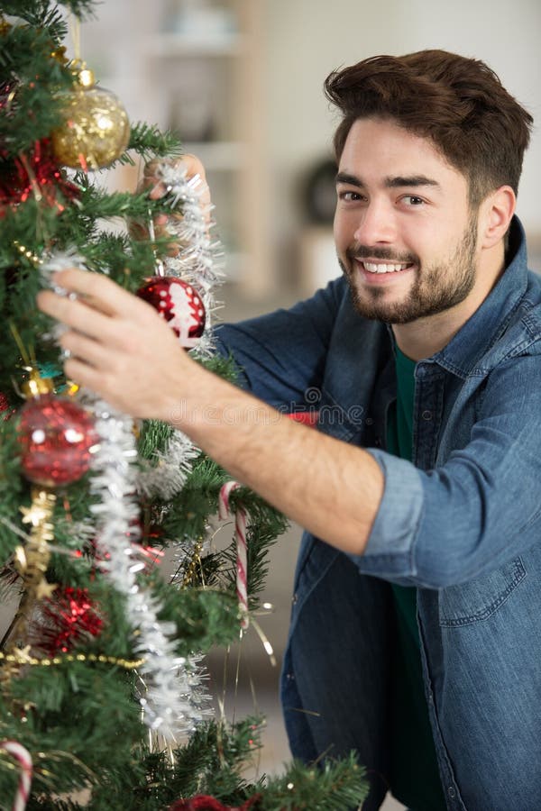 Man with Christmas Tree Decoration Stock Photo - Image of lifestyle ...