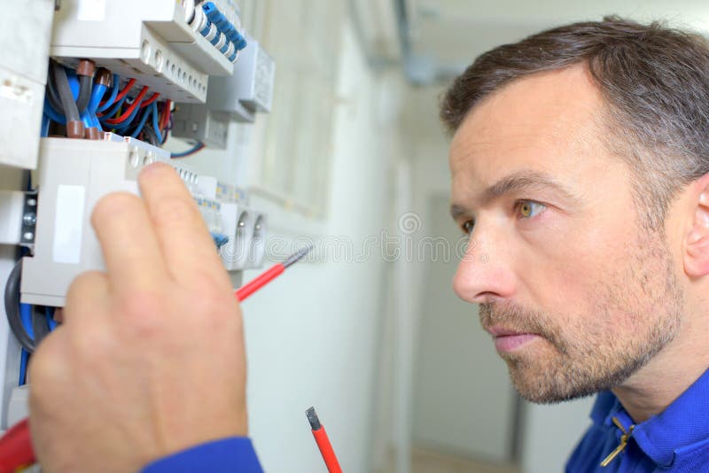 Man and circuit breaker stock photo. Image of cord, overloads - 231108522