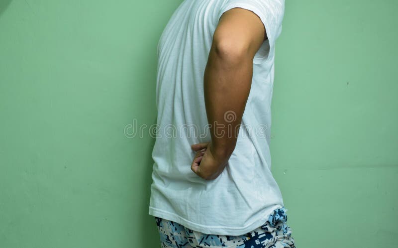 A Man Clapping His Back with His Fist Stock Photo - Image of hand, fist ...