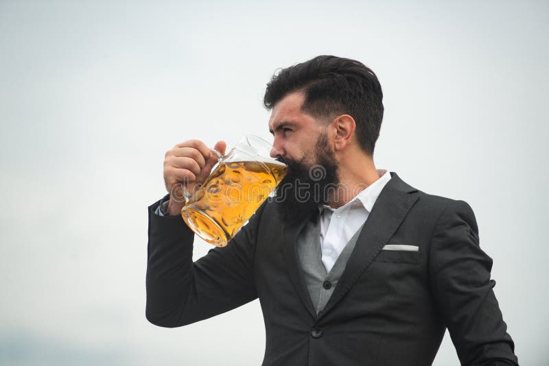 Man in Classic Suit Drinking Beer. Portrait of Man with Big Cup of Beer ...