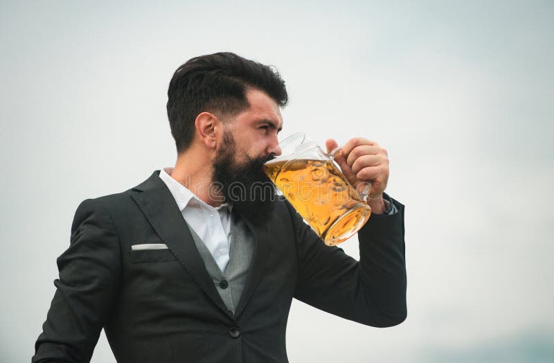 Man in Classic Suit Drinking Beer. Portrait of Man with Big Cup of Beer ...