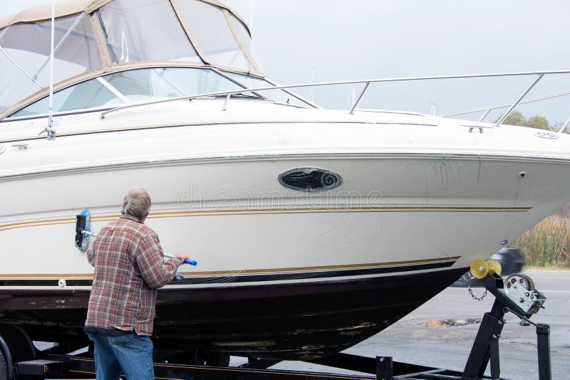 Man cleaning boat hull stock photo. Image of boat, cleaning - 90910842
