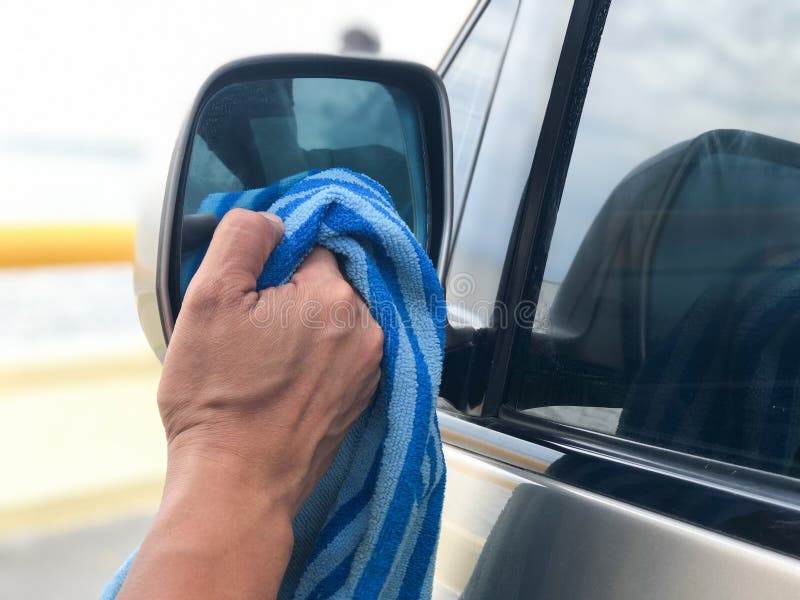 Man Cleaning Car Mirror with Microfiber Cloth Stock Photo - Image of ...
