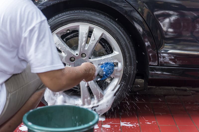 Man Cleaning the Car Wheels Stock Image - Image of background, shiny ...