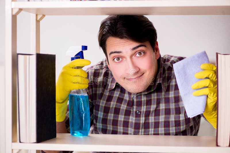 The Man Cleaning Dust from Bookshelf Stock Photo - Image of husband ...