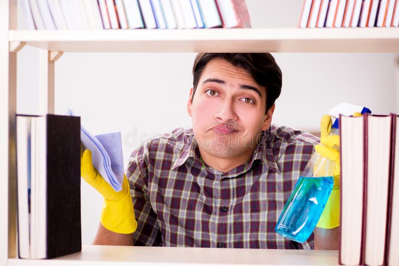 The Man Cleaning Dust from Bookshelf Stock Image - Image of brush ...