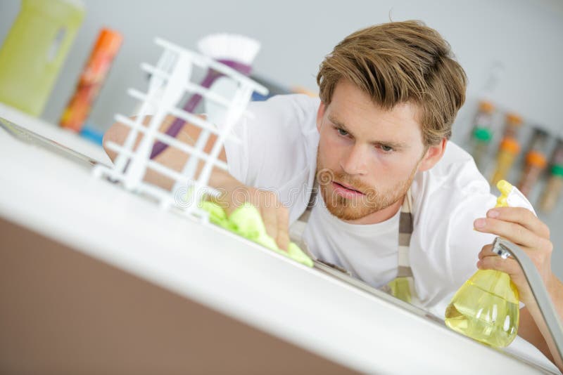 Man cleaning his flat stock image. Image of cheerful - 116226271