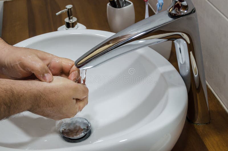 MAN CLEANING HIS HANDS stock image. Image of healthy - 177060747