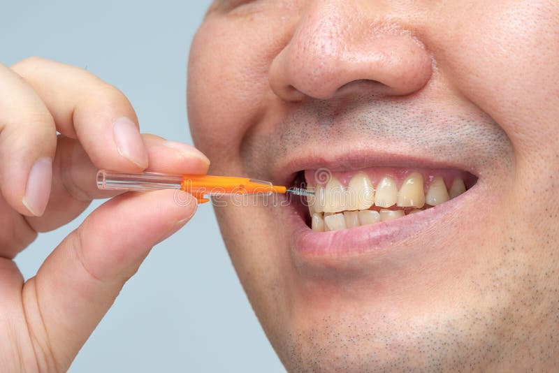 Man Cleaning His Teeth with an Interdental Brush Stock Photo - Image of ...