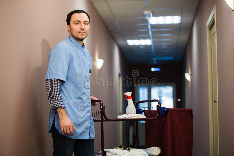 Man Cleaning Hotel Hall Wearing Blue Coat Stock Image - Image of ...