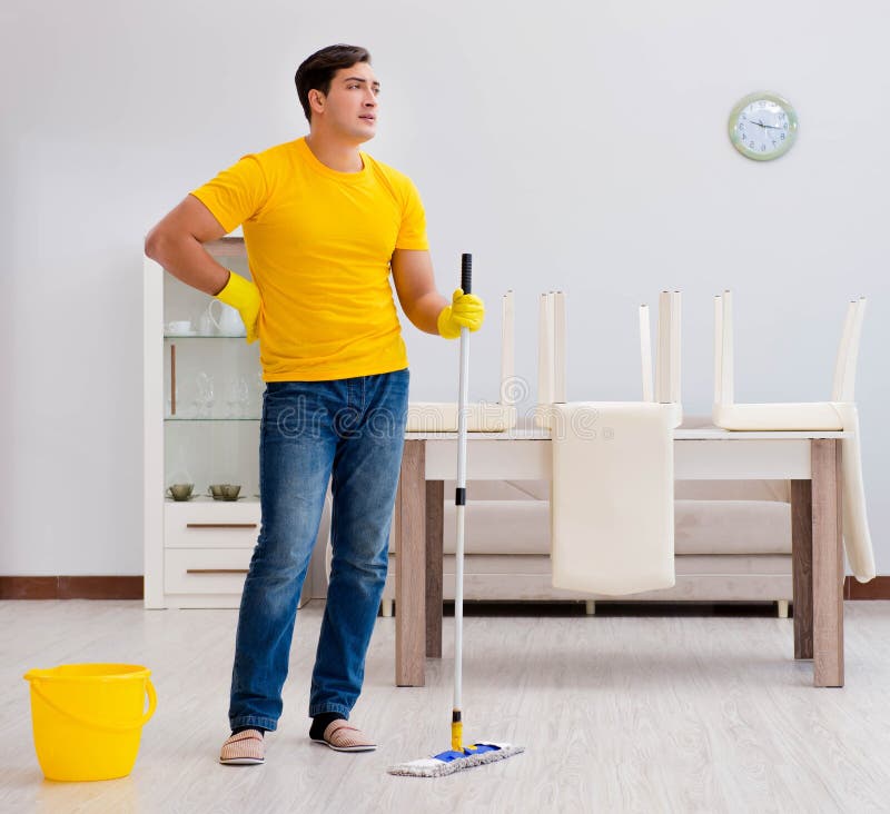 Man Cleaning the House Helping His Wife Stock Image - Image of ...