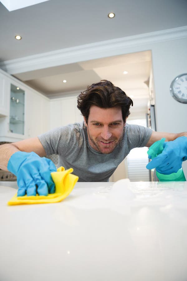 Man Cleaning Kitchen Worktop at Home Stock Image - Image of life ...