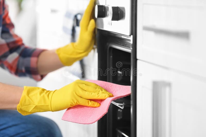 Cleaning an oven stock image. Image of gloves, cleaning - 28409553