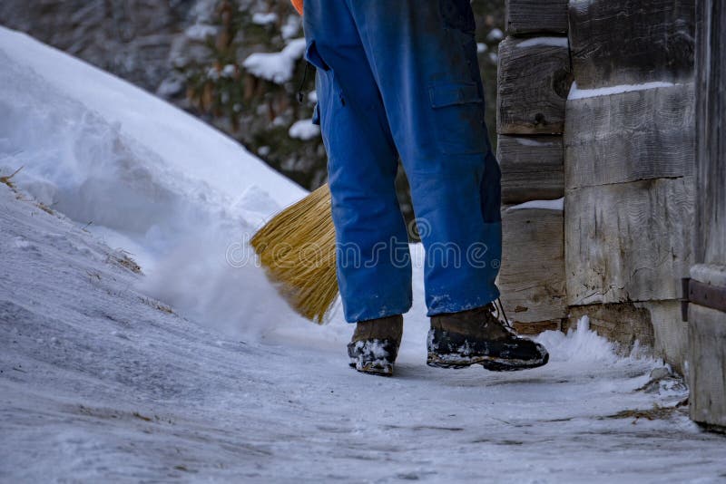 Man Cleaning Snow with a Broom Stock Image - Image of outdoors, storm ...