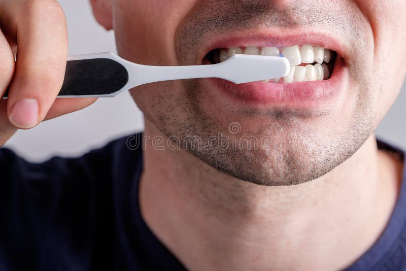 Man Cleaning Teeth with Tooth Brush Stock Image - Image of background ...