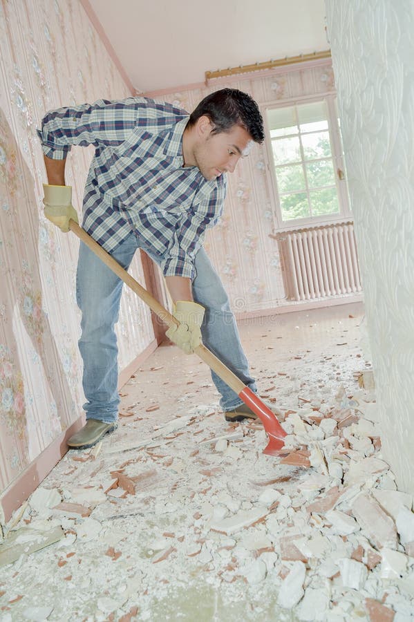 Man Cleaning Up Rubble with Shovel Stock Image - Image of partition ...