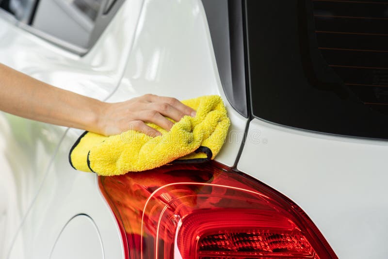 A Man Cleaning White Car with Yellow Microfiber Cloth. Stock Image ...
