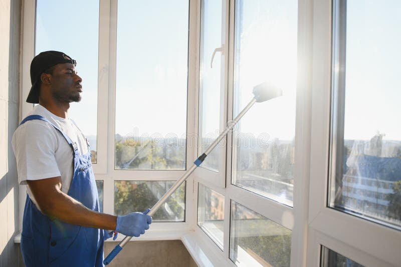 A Man Cleaning Windows. Men Washes the Windows Stock Photo - Image of ...