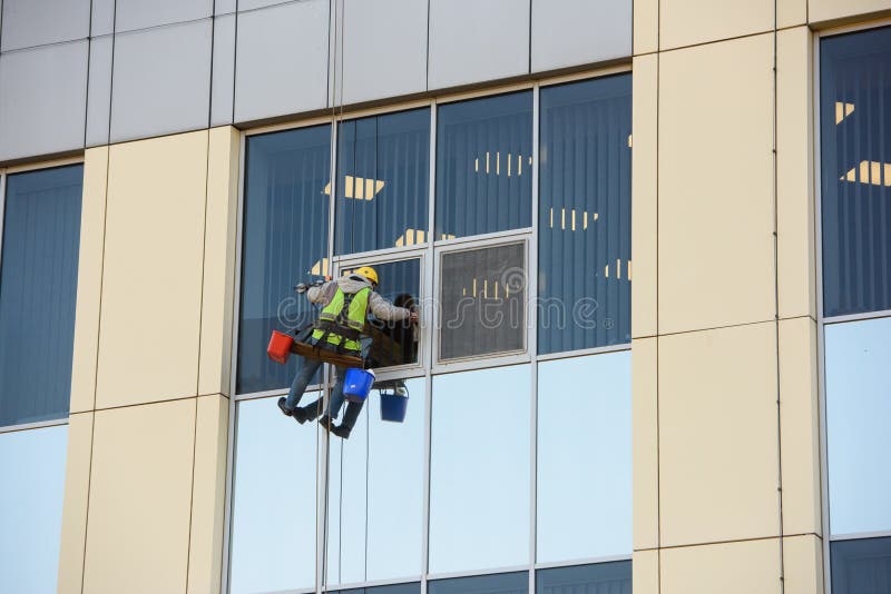 Man Cleaning Windows on a Office Building Stock Image - Image of high ...