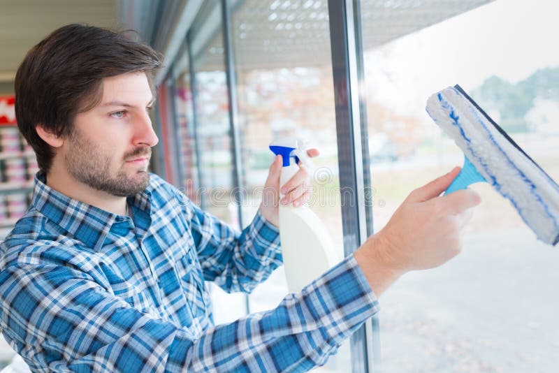 Man Cleaning Windows in Shop Stock Photo - Image of shop, handsome ...