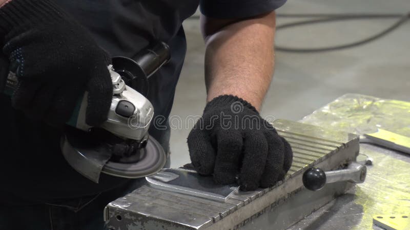 A Man Cleans the Detail from Deburring Machine. Stock Photo - Image of ...