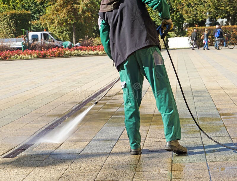 Man Cleans the Paving Stone on the Street Stock Photo - Image of steam ...