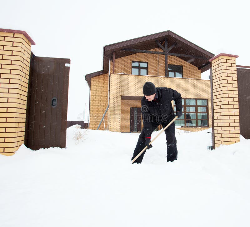 Man Cleans Snow Around House Stock Photo - Image of occupation, adult ...