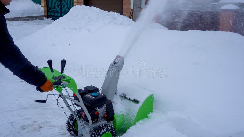 A Man Cleans Snow in the Winter in the Courtyard of the House. Man ...