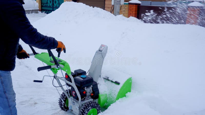 A Man Cleans Snow in the Winter in the Courtyard of the House. Man ...