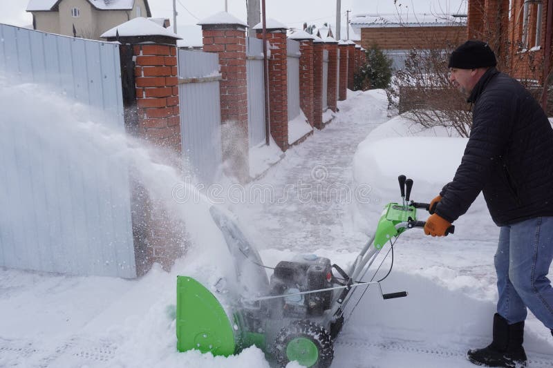 A Man Cleans Snow in the Winter in the Courtyard of the House, Man ...