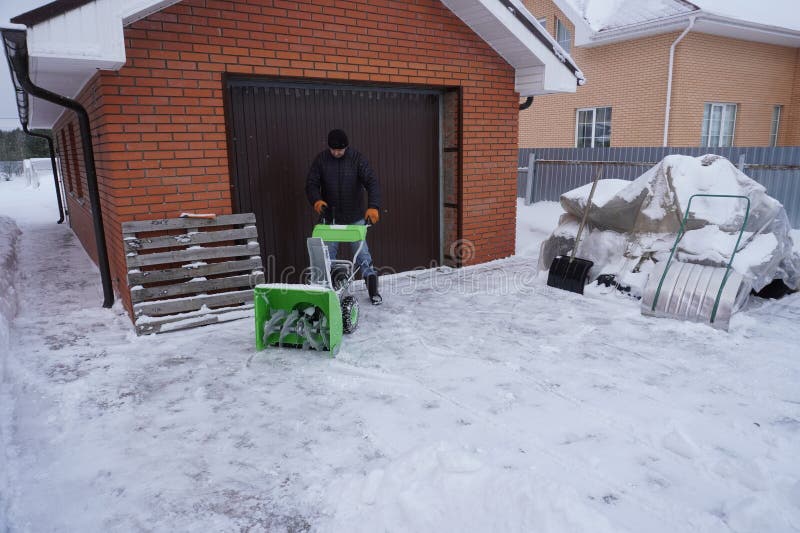 A Man Cleans Snow in the Winter in the Courtyard of the House, Man ...