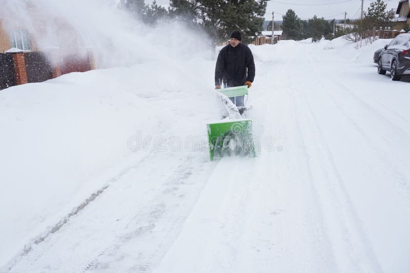 A Man Cleans Snow in the Winter in the Courtyard of the House, Man ...