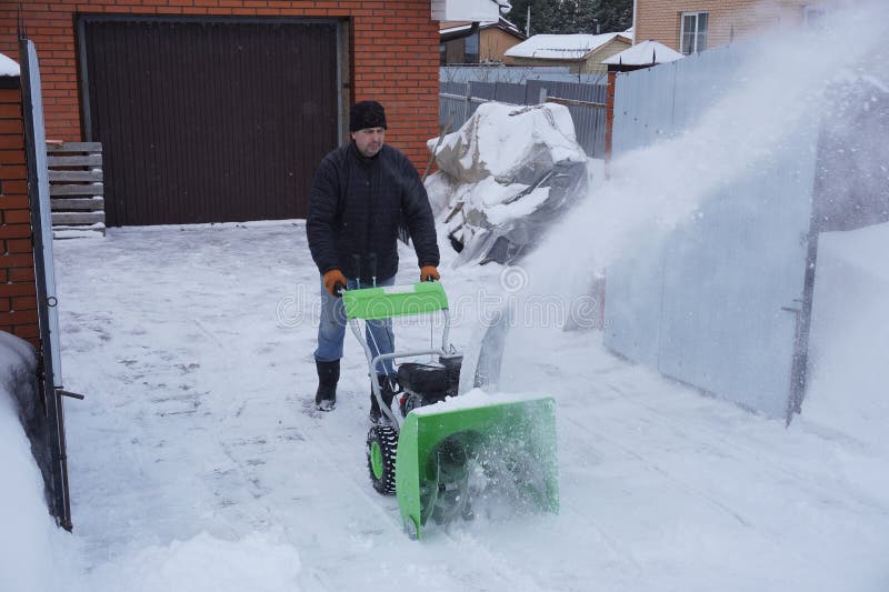A Man Cleans Snow in the Winter in the Courtyard of the House, Man ...