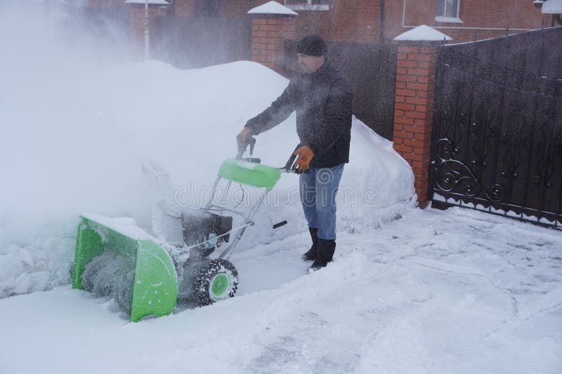 A Man Cleans Snow in the Winter in the Courtyard of the House, Man ...