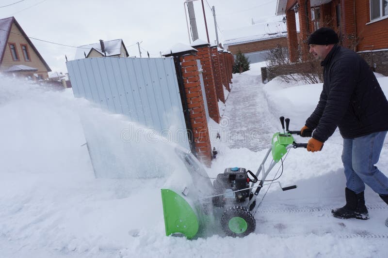 A Man Cleans Snow in the Winter in the Courtyard of the House, Man ...