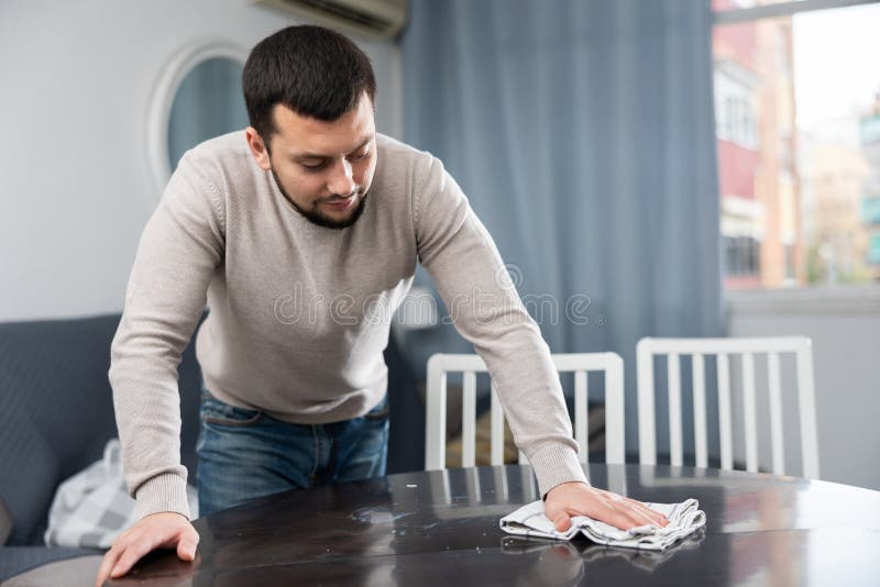 Man Cleans the Table with a Rag while Son Vacuums Room Stock Image ...