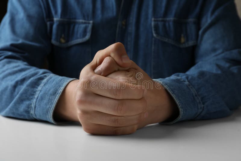 Man Clenching Hands at Table while Restraining Anger, Closeup Stock ...