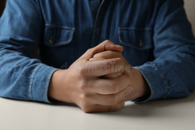 Man Clenching Hands at Table while Restraining Anger, Closeup Stock ...
