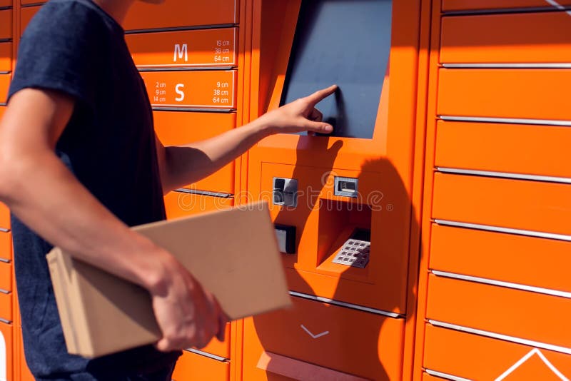 Man Client Using Automated Self Service Post Terminal Machine or Locker ...