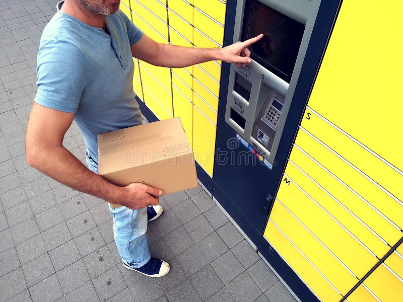 Man Client Using Automated Self Service Post Terminal Machine or Locker ...