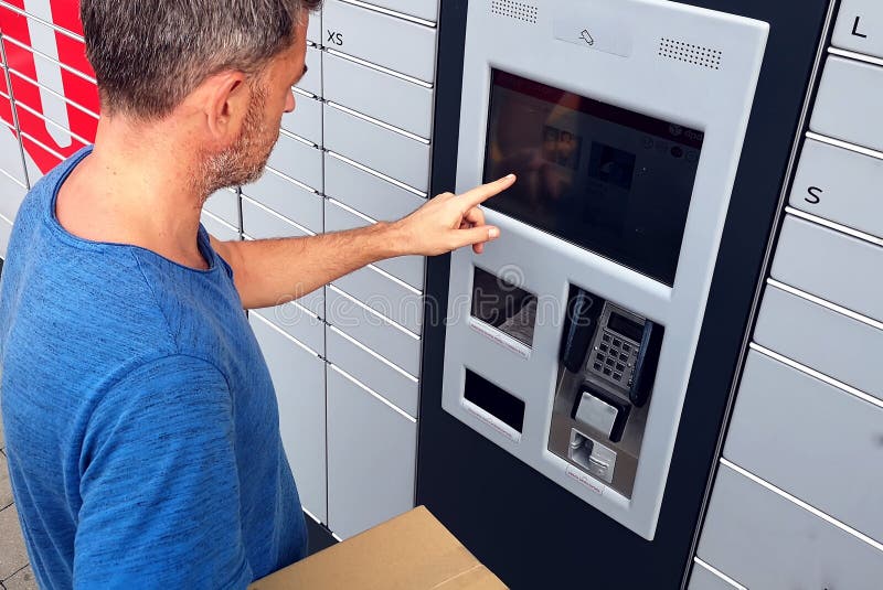 Client Using Automated Self Service Post Terminal Machine or Locker To ...