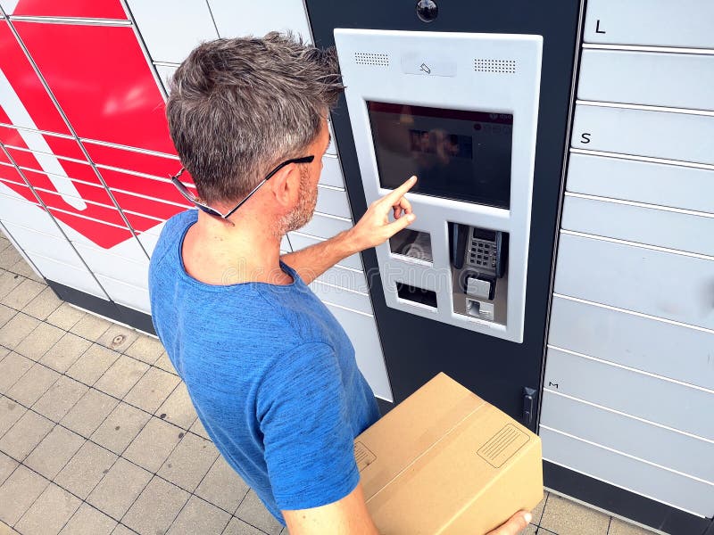 Client Using Automated Self Service Post Terminal Machine or Locker To ...