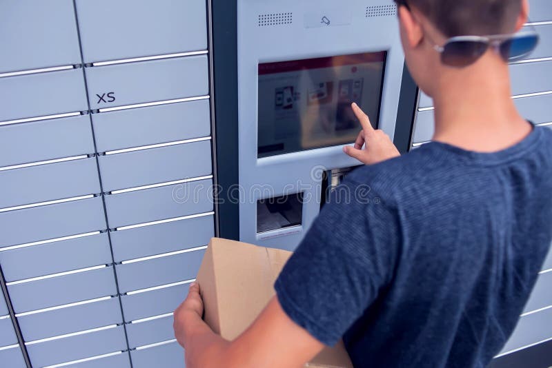 Client Using Automated Self Service Post Terminal Machine or Locker To ...