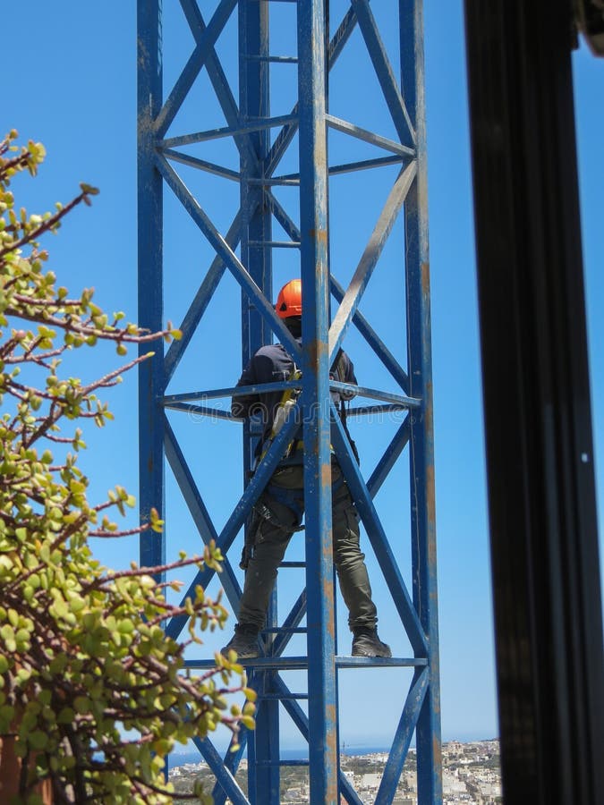 Man Climbing a Crane in Valletta Editorial Stock Image - Image of ...