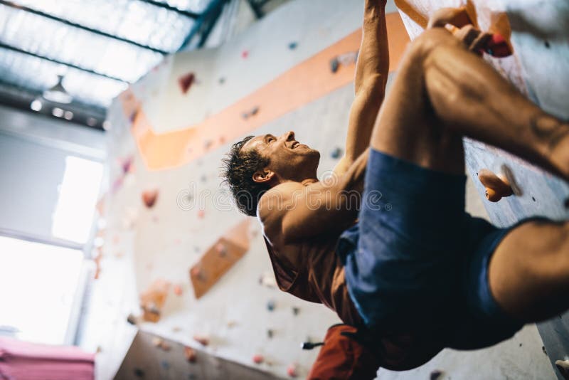 Man Climbing Indoor Boulder Wall Stock Image - Image of challenge ...