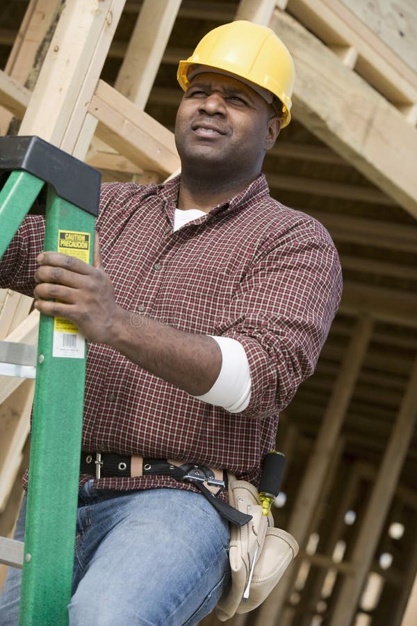 Man Climbing a Ladder at Construction Site Stock Image - Image of ...
